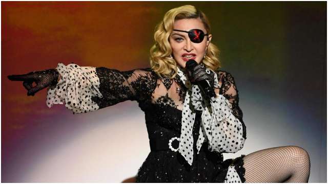 Madonna shows off her flat abs, svelte figure alongside 'beautiful scar ...