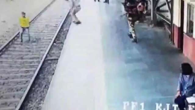 WATCH: Boy jumps on rail tracks, here's how police officer saves him