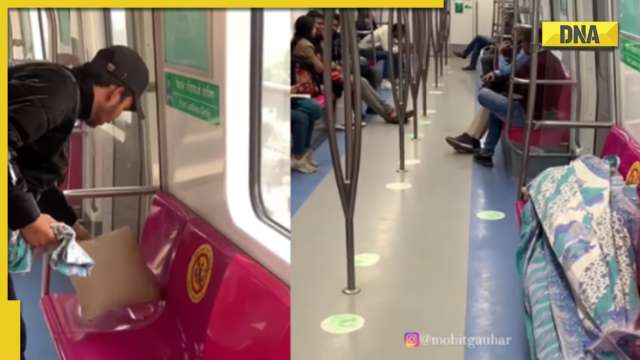 Man makes bed on empty seat and then sleeps inside Delhi metro, viral ...